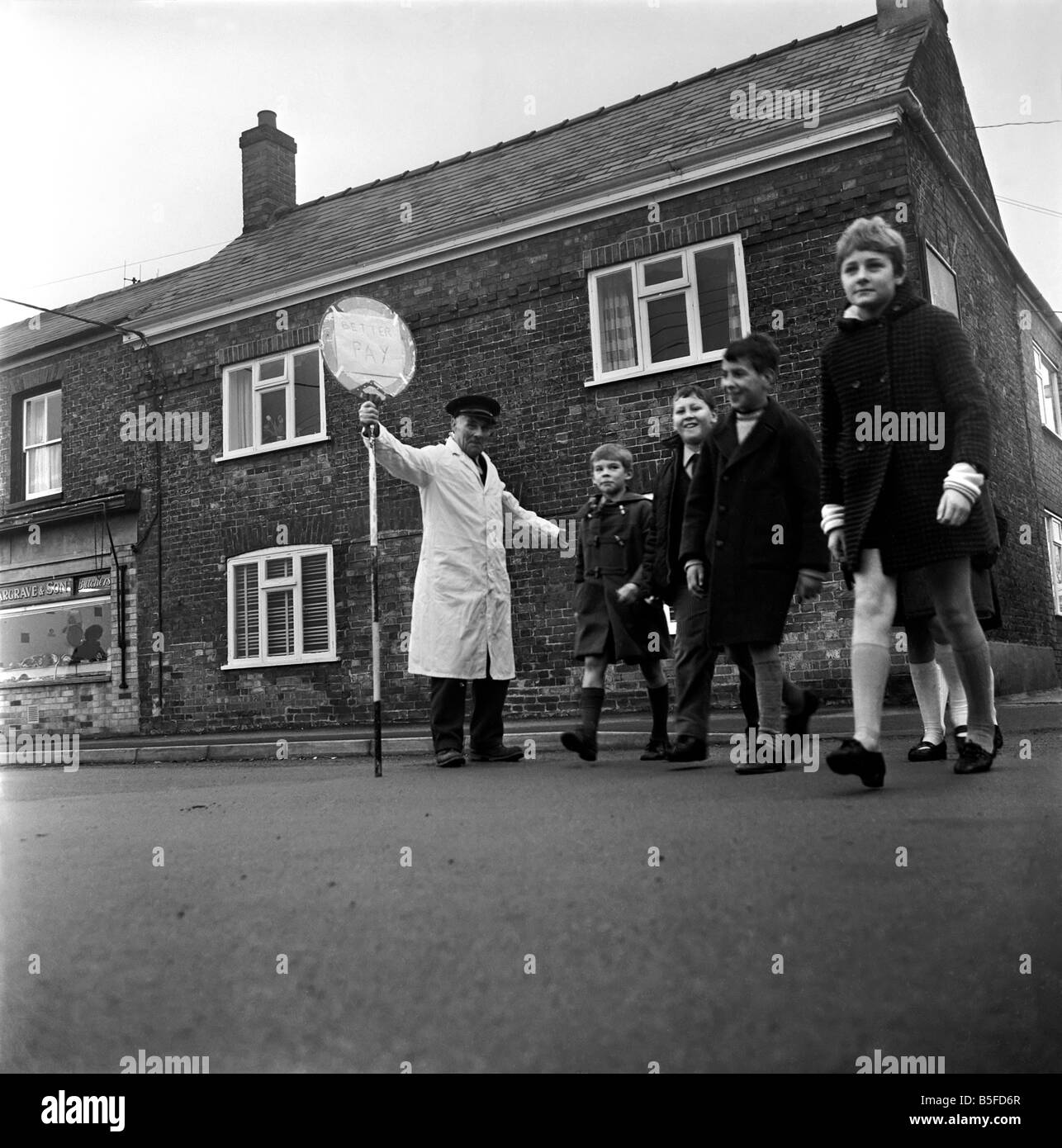 Lollipop man crossing Black and White Stock Photos & Images - Alamy