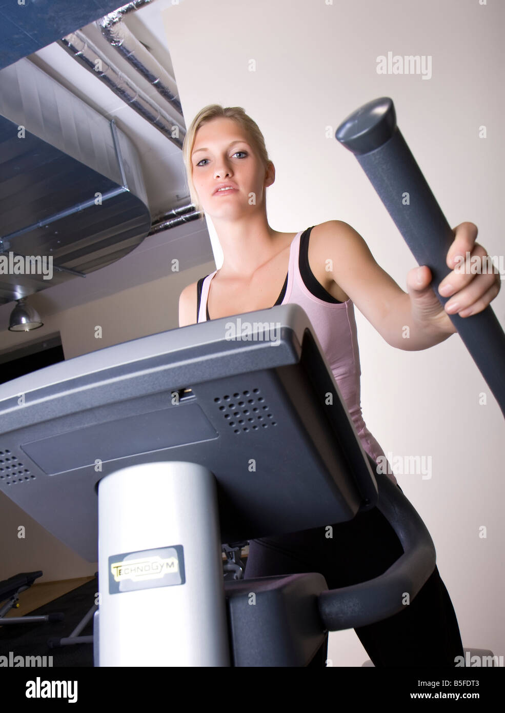 young woman training on Stairmaster Stock Photo - Alamy