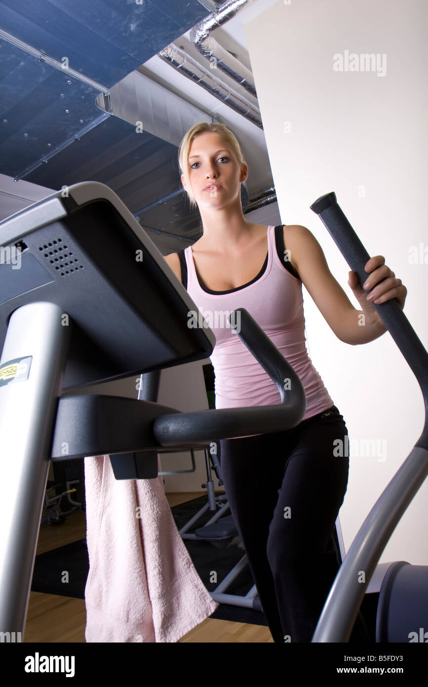 young woman training on Stairmaster Stock Photo - Alamy