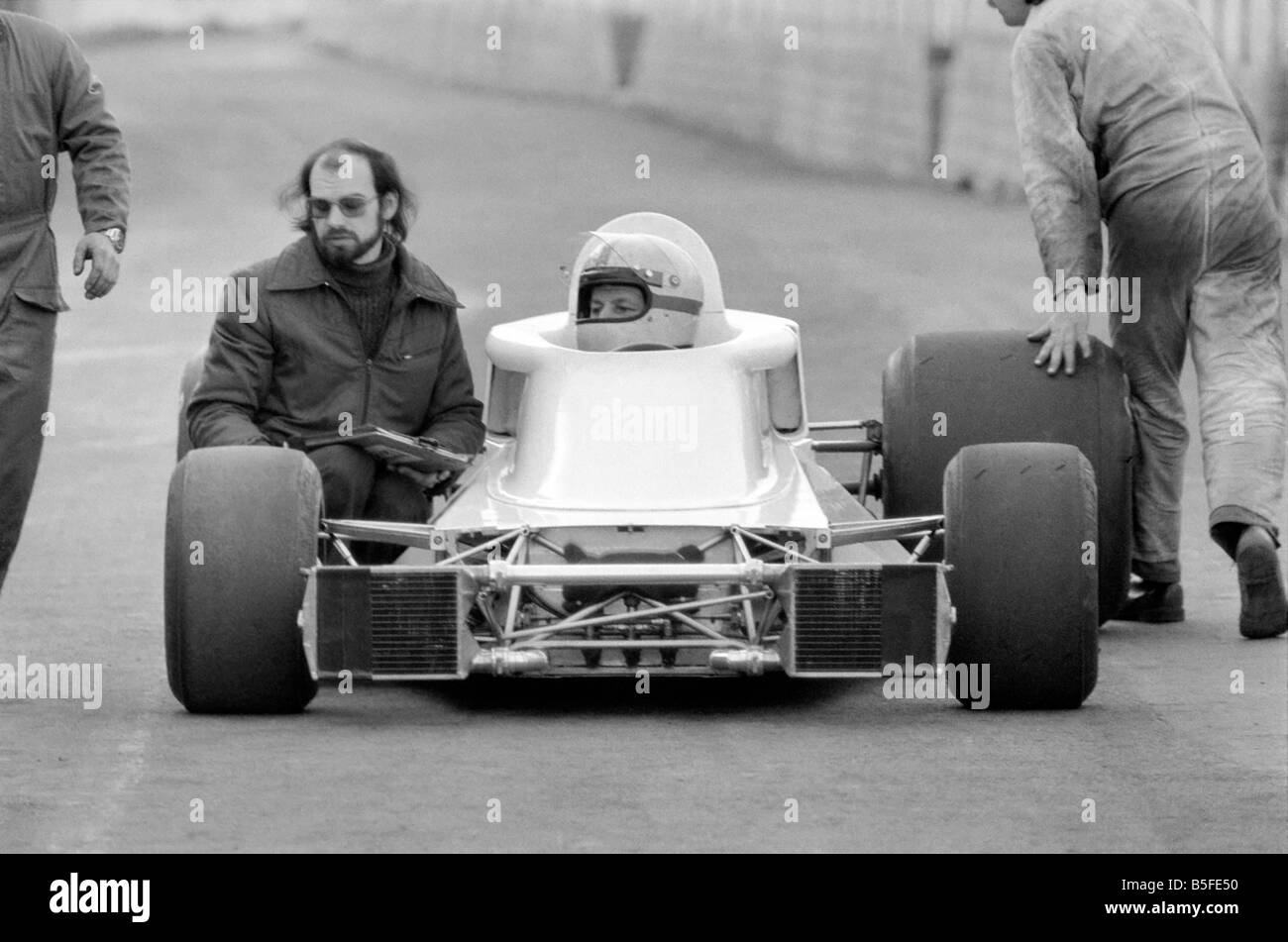 Racing driver John Surtees and his new racing car. January 1976 S76 ...