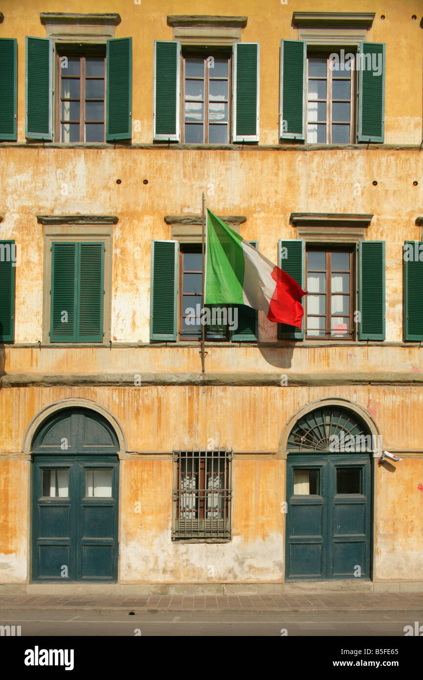 Italian flag hanging from University building in Pisa, Italy Stock ...