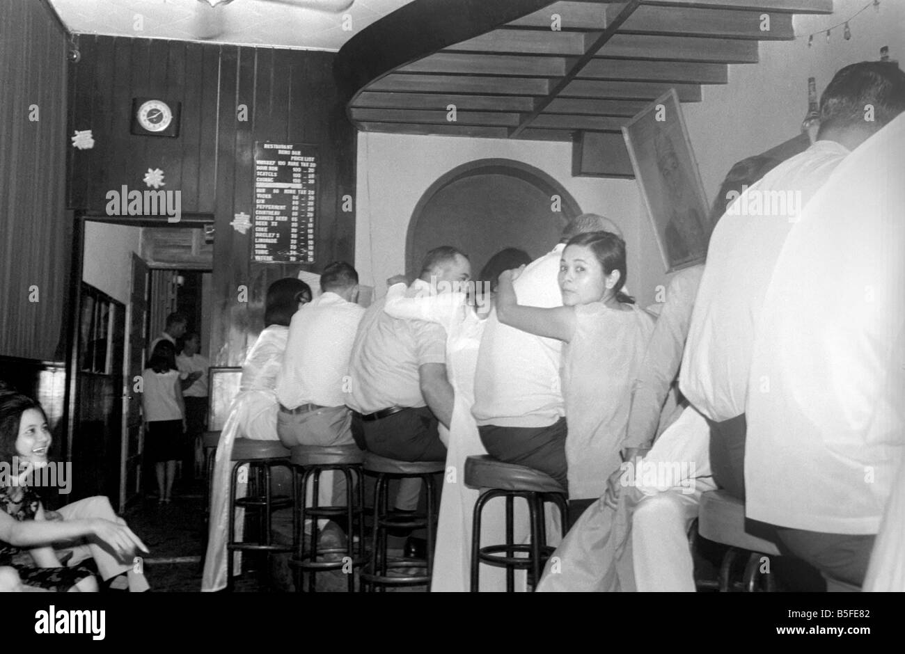 Night life in Saigon Vietnam. Local women provide company at the bar to ...
