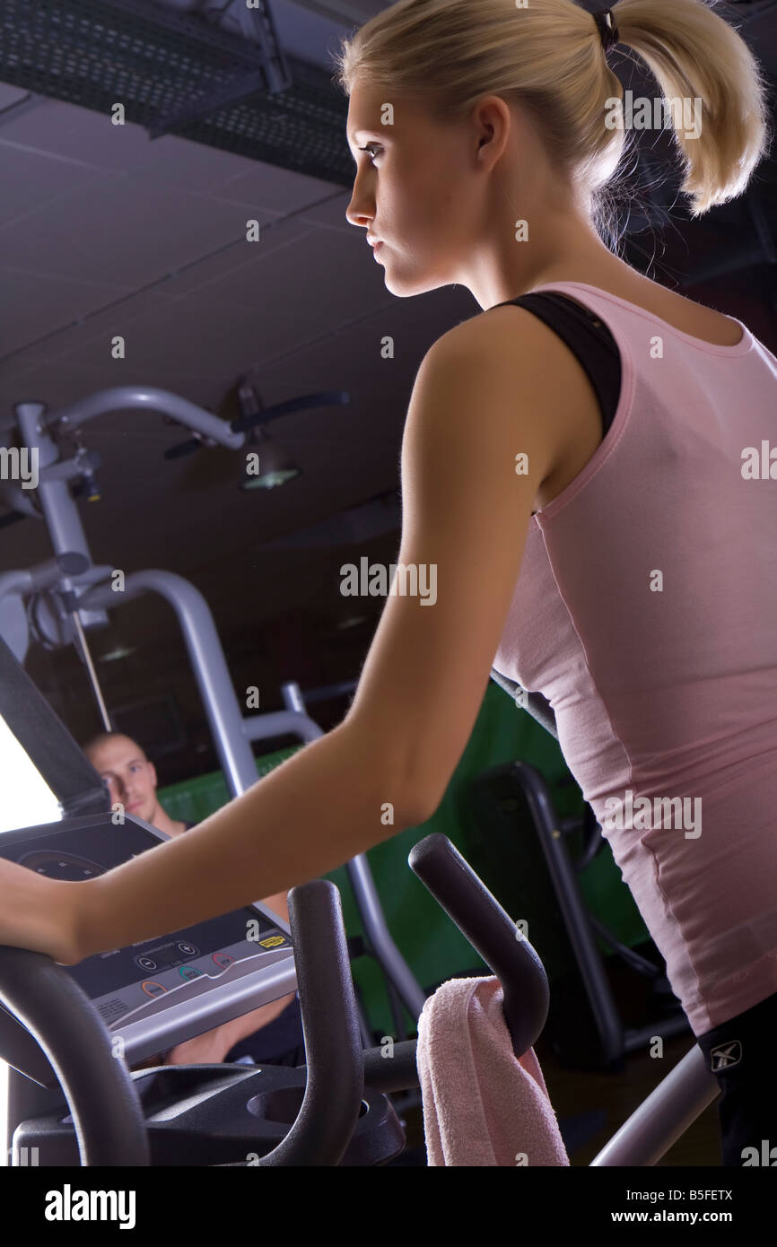 young woman training on Stairmaster Stock Photo - Alamy