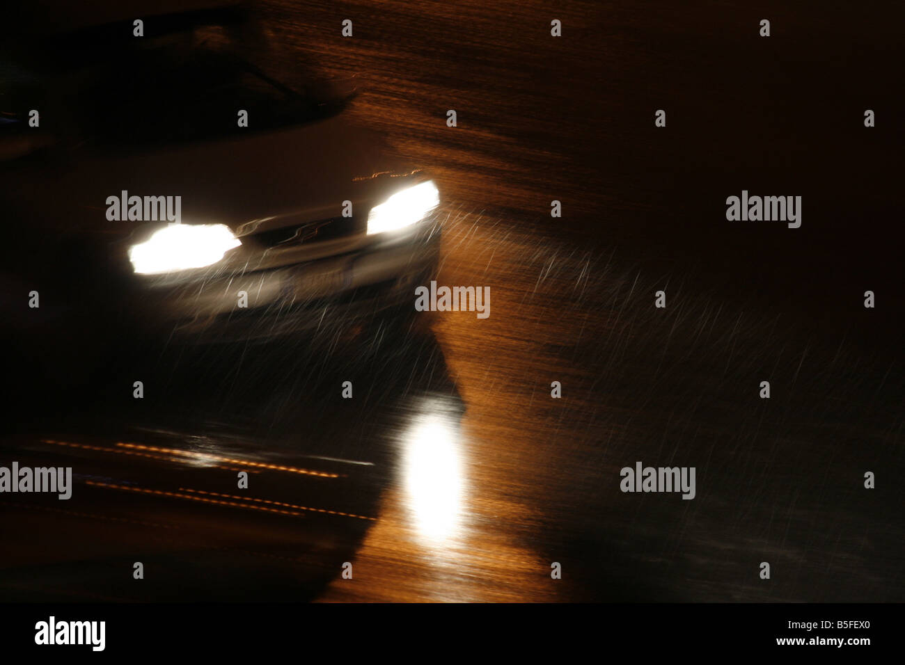 fast car driving in heavy rain at night in town Stock Photo - Alamy