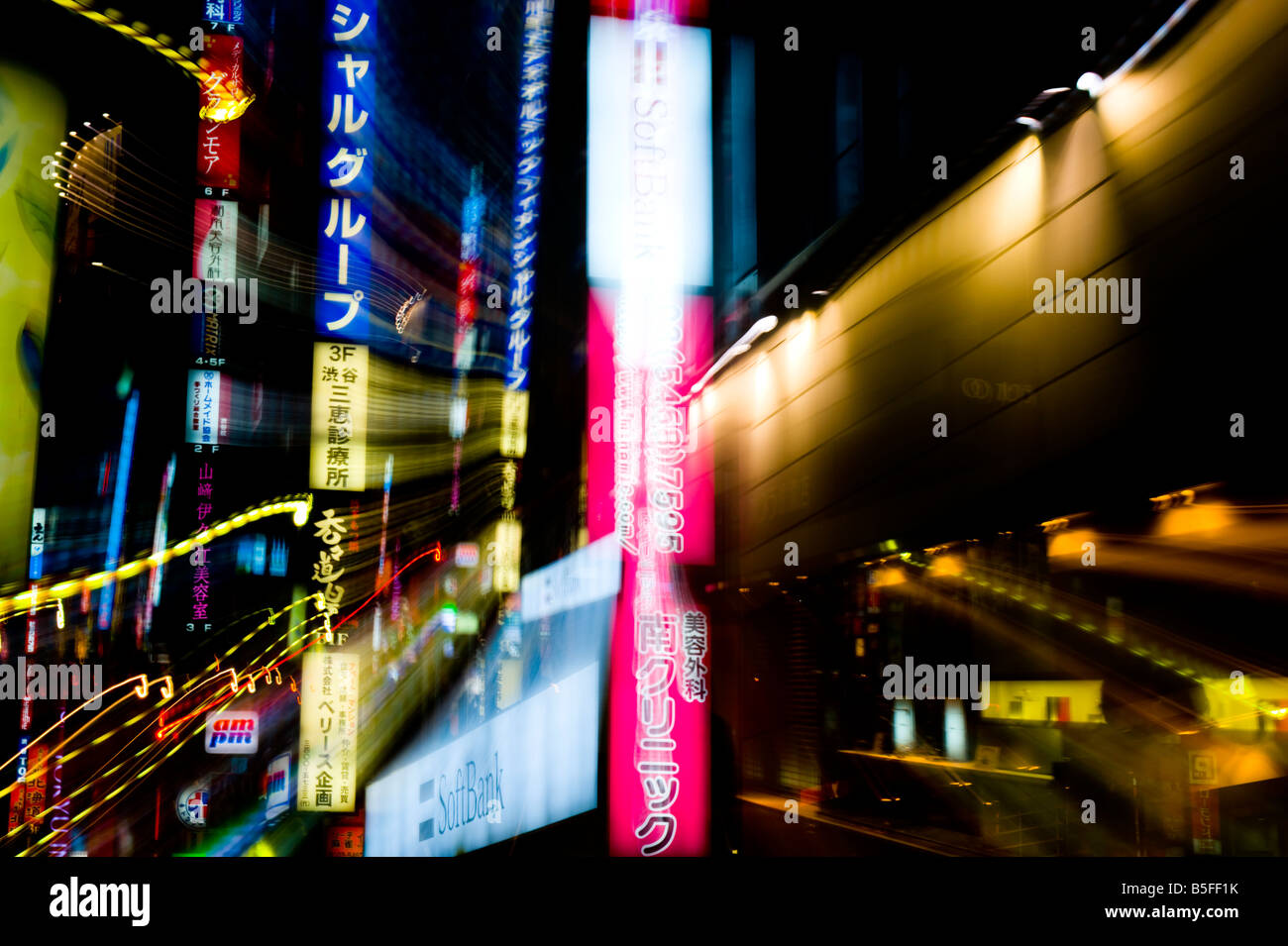 Zoom burst effect of neon signs in the streets of Shibuya, Tokyo, Japan ...