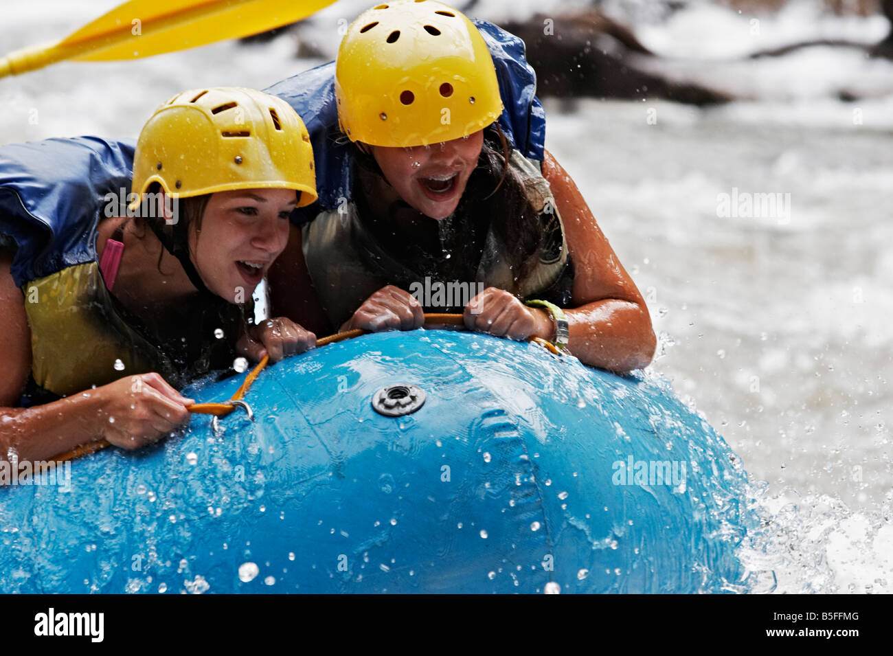 Two young girls on the front of a raft going down the Ocoee River in ...