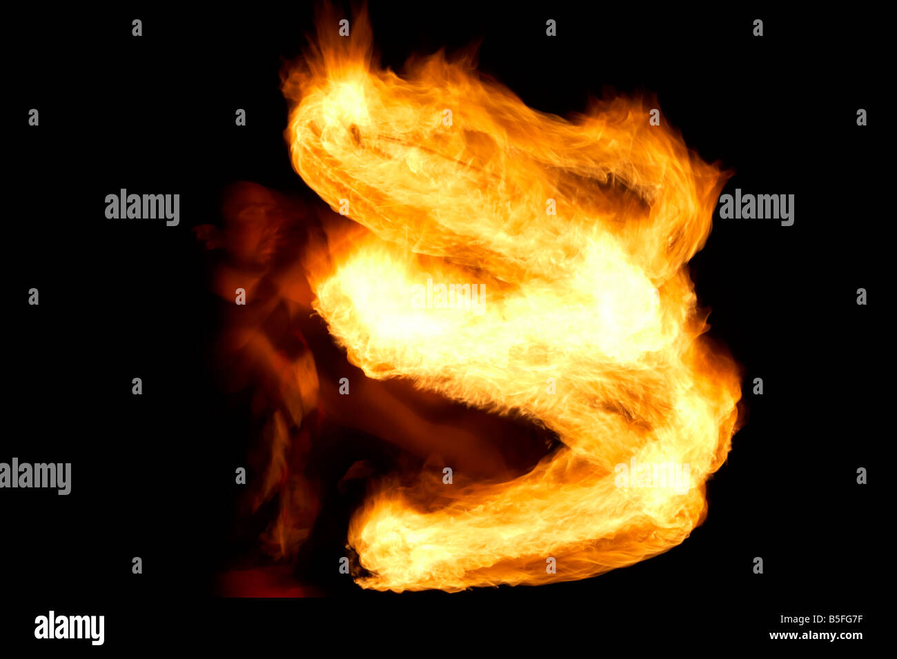 firepoise man performance artist displaying fire patterns with fire ...