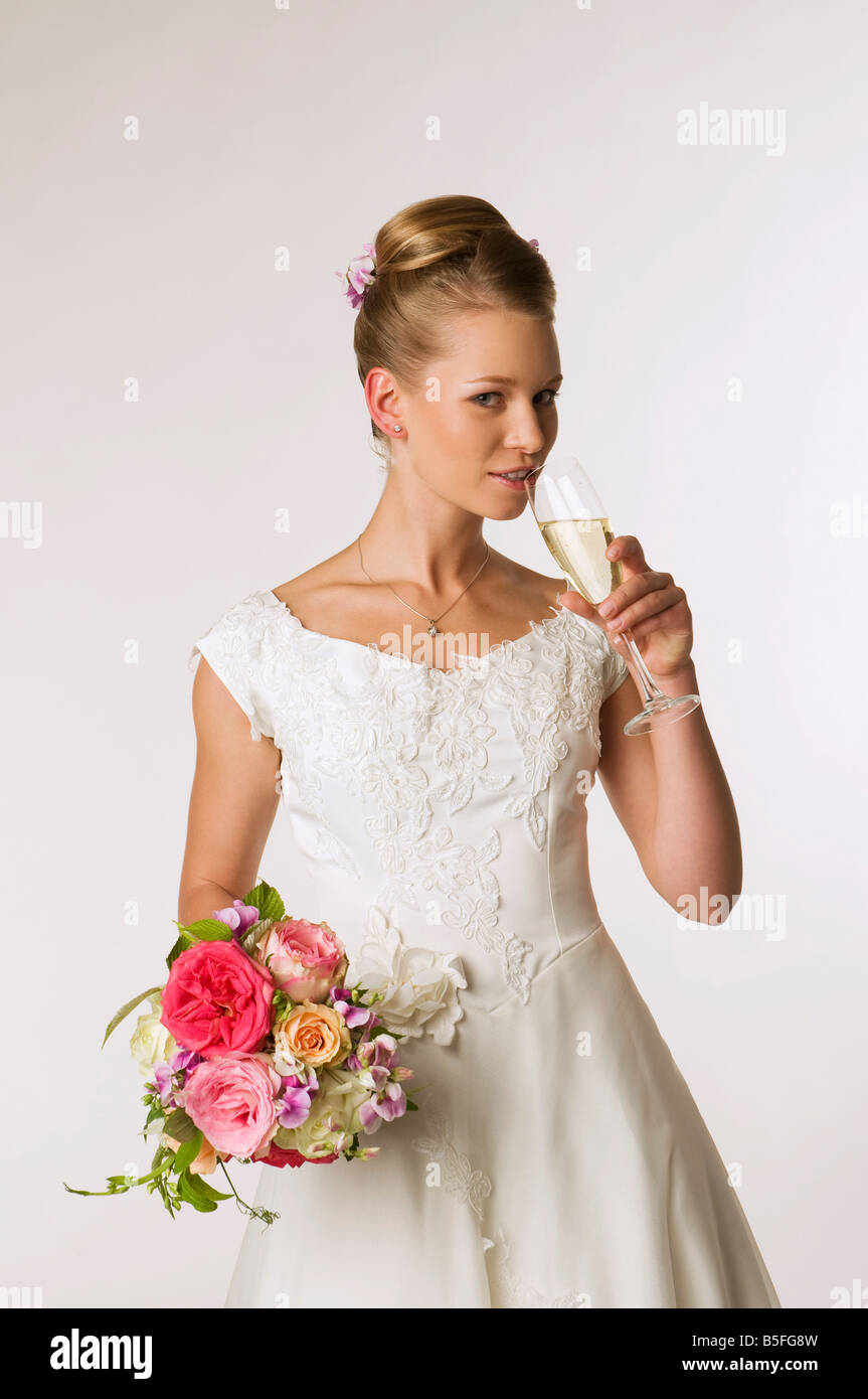 Young bride drinking champagne, portrait Stock Photo - Alamy