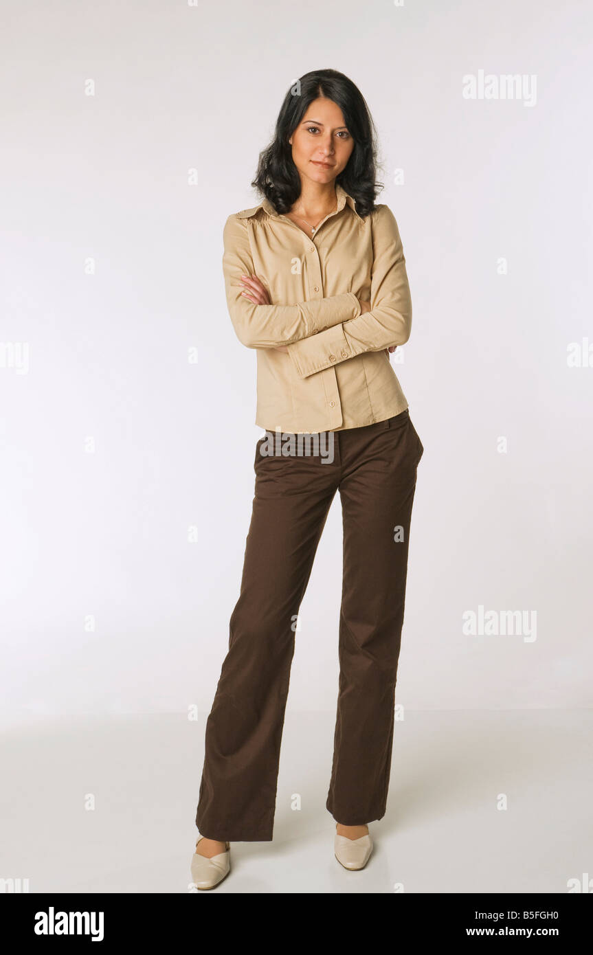 Young woman arms folded, portrait Stock Photo - Alamy