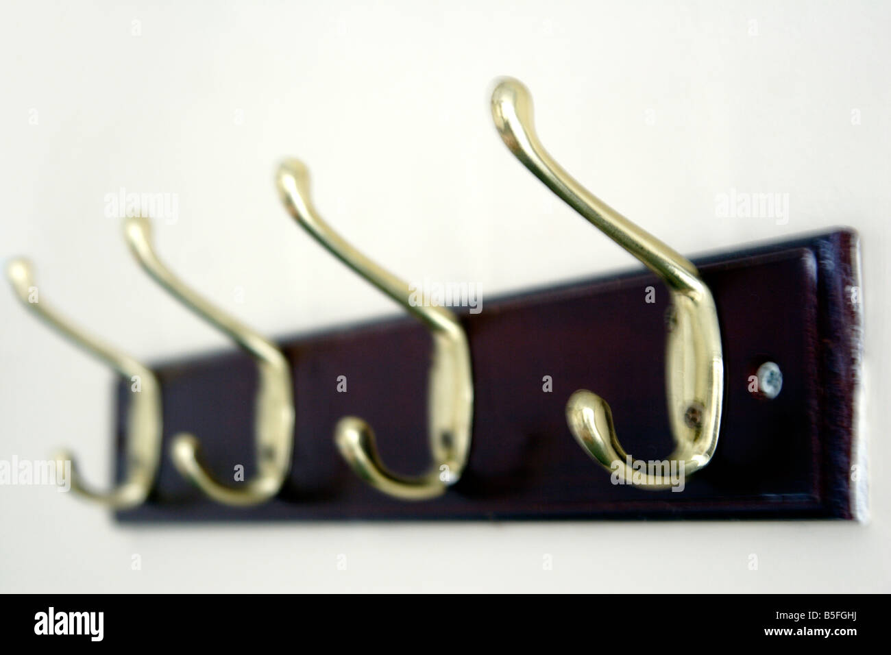 Metal coat pegs close up Stock Photo - Alamy