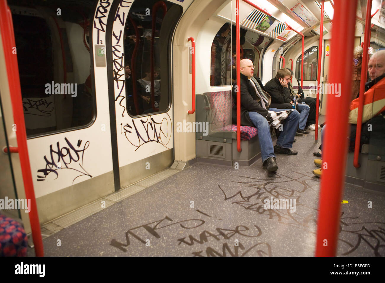 Graffitied interior of a London tube train Stock Photo - Alamy