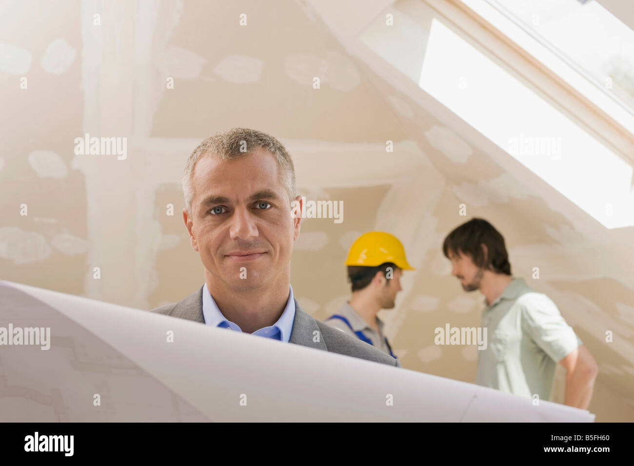 Man holding construction plan, close up Stock Photo - Alamy