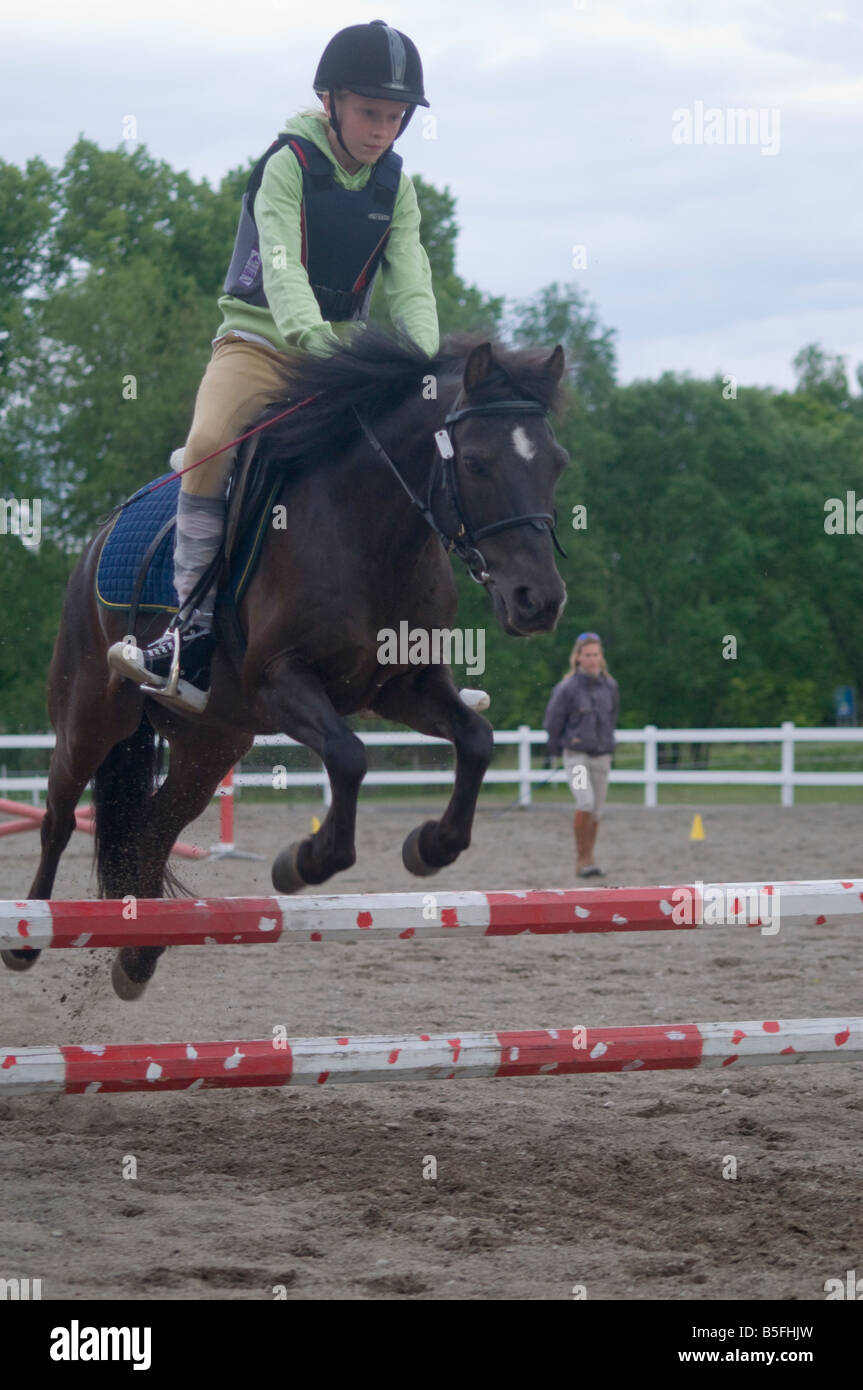 Child jump horse hi-res stock photography and images - Alamy