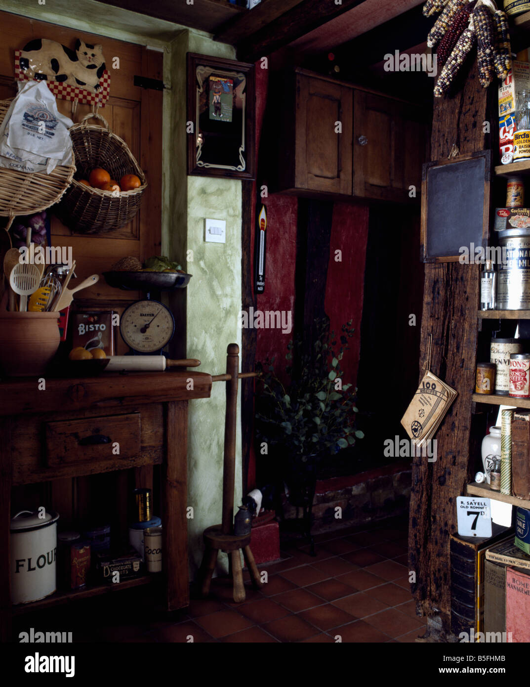 Scales on worktop in dark and cluttered cottage kitchen Stock Photo - Alamy