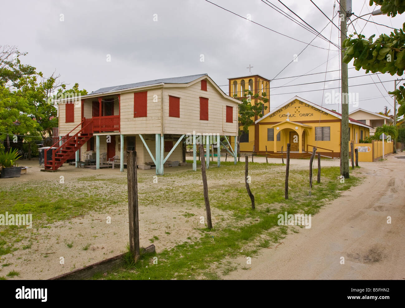 CAYE CAULKER BELIZE Traditional wooden cottage on stilts with shutters ...