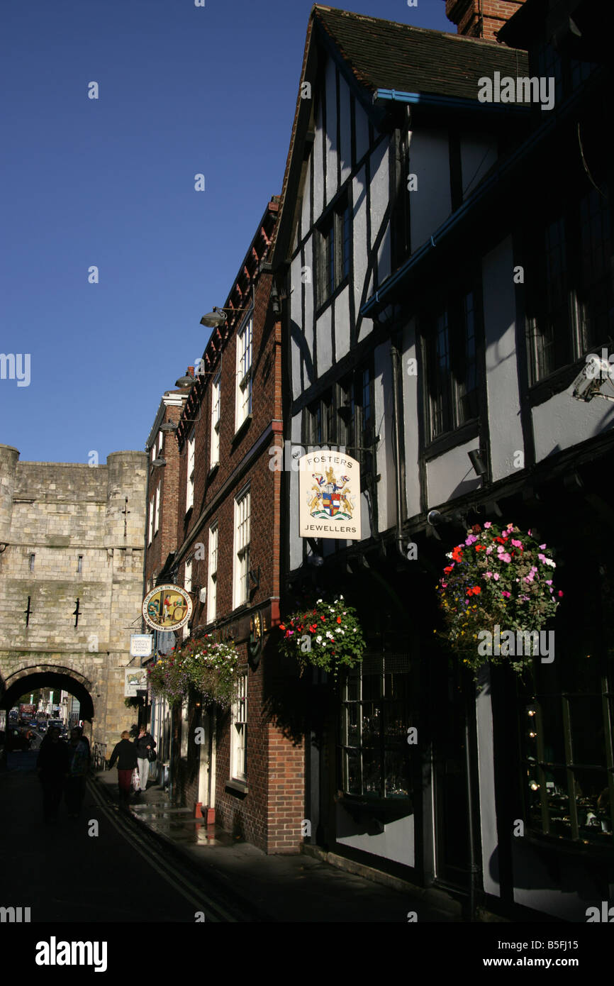 City of York, England. Retail shops in High Petergate, with Bootham Bar ...