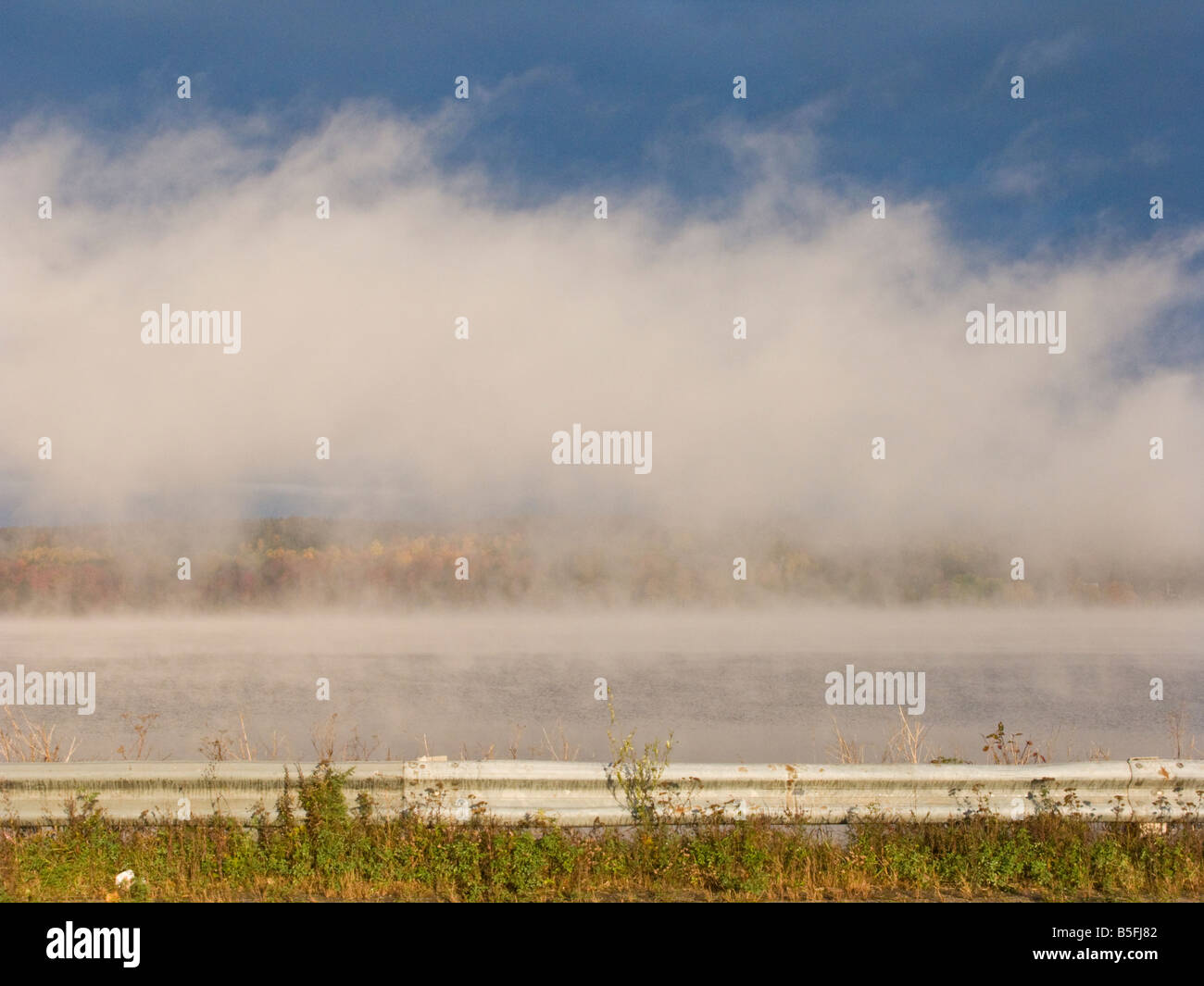 Heavy morning fog along the St John River during the fall with fall ...