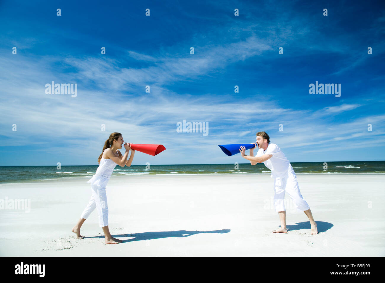 Megaphone woman beach hi-res stock photography and images - Alamy