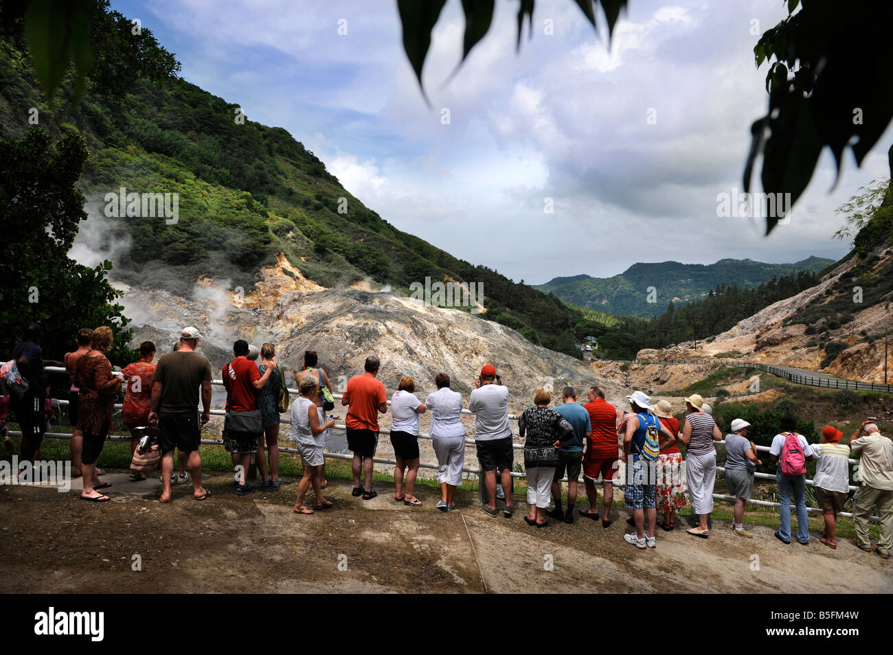 TOURISTS VIEWING THE SULPHUR POOLS IN THE CRATER OF MOUNT SOUFRIERE ST ...