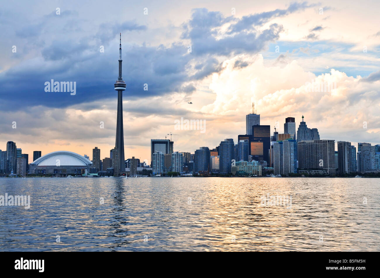 Scenic view at Toronto city waterfront skyline at sunset Stock Photo ...