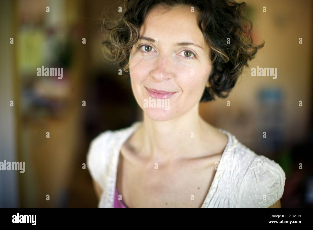 Skinny, smiling fortyish woman with a bright shiny new bob hairdo and ...