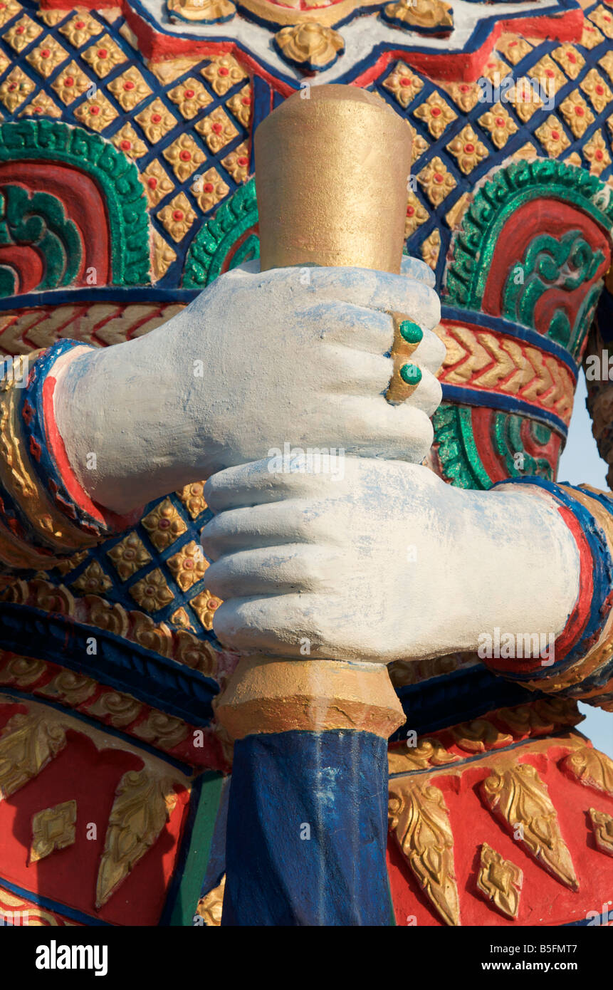 Carved statue hands hold a sword in thai temple hi-res stock ...