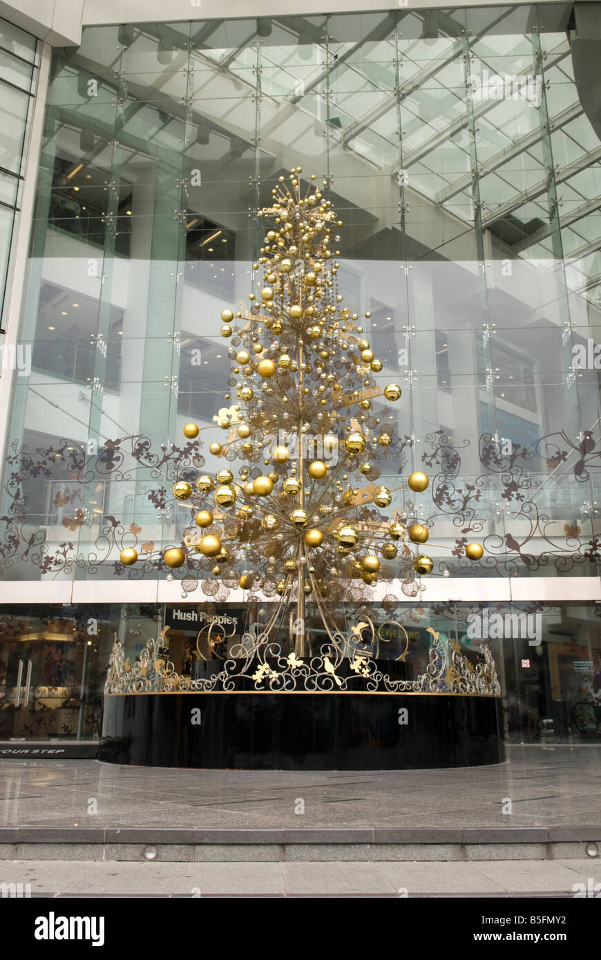 A Golden Christmas Tree outside a shopping mall in Singapore Stock ...