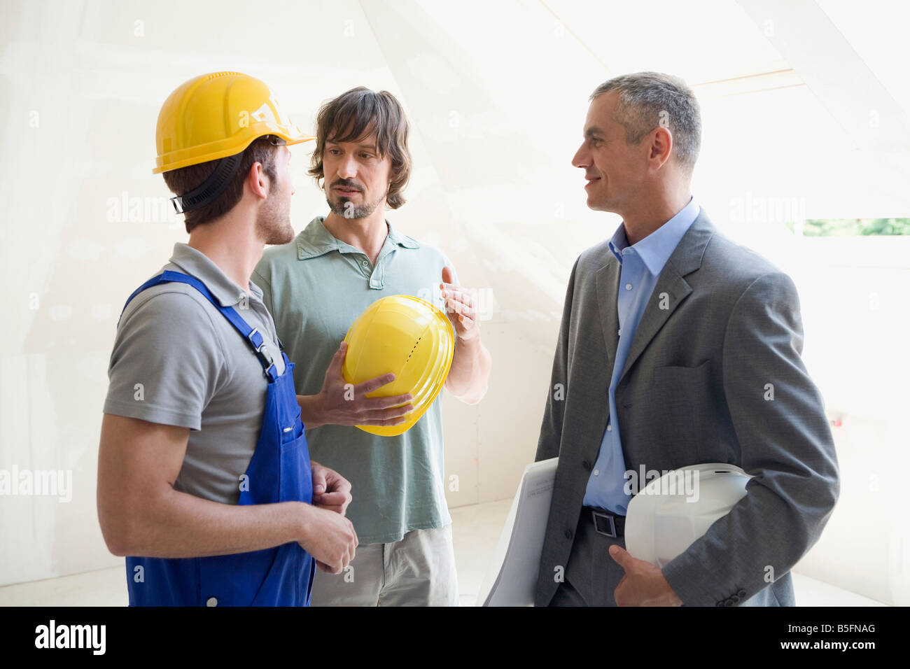 Construction conversation suit hardhat hi-res stock photography and ...