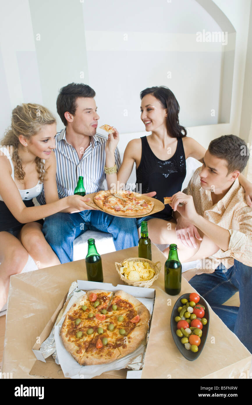 friends eating pizza Stock Photo - Alamy