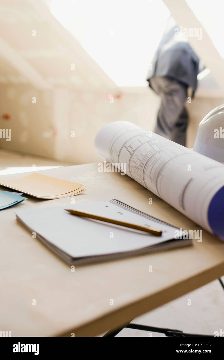 Construction site, Blueprints and notepad on table Stock Photo - Alamy