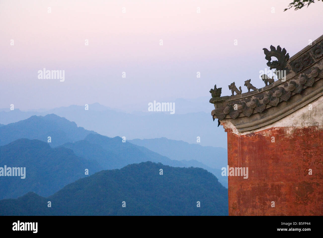 Taoist temple with mountain in the distance in at sunrise Jinding ...