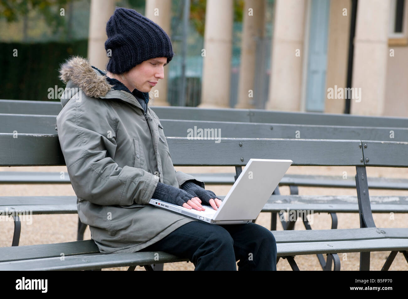 young male using laptop computer Stock Photo - Alamy