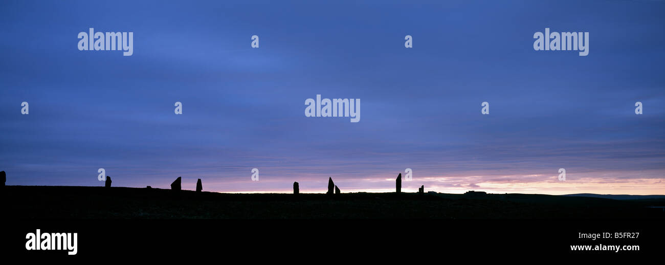 Evening sunset and dark brooding skies outlining Ring of Brodgar Orkney ...