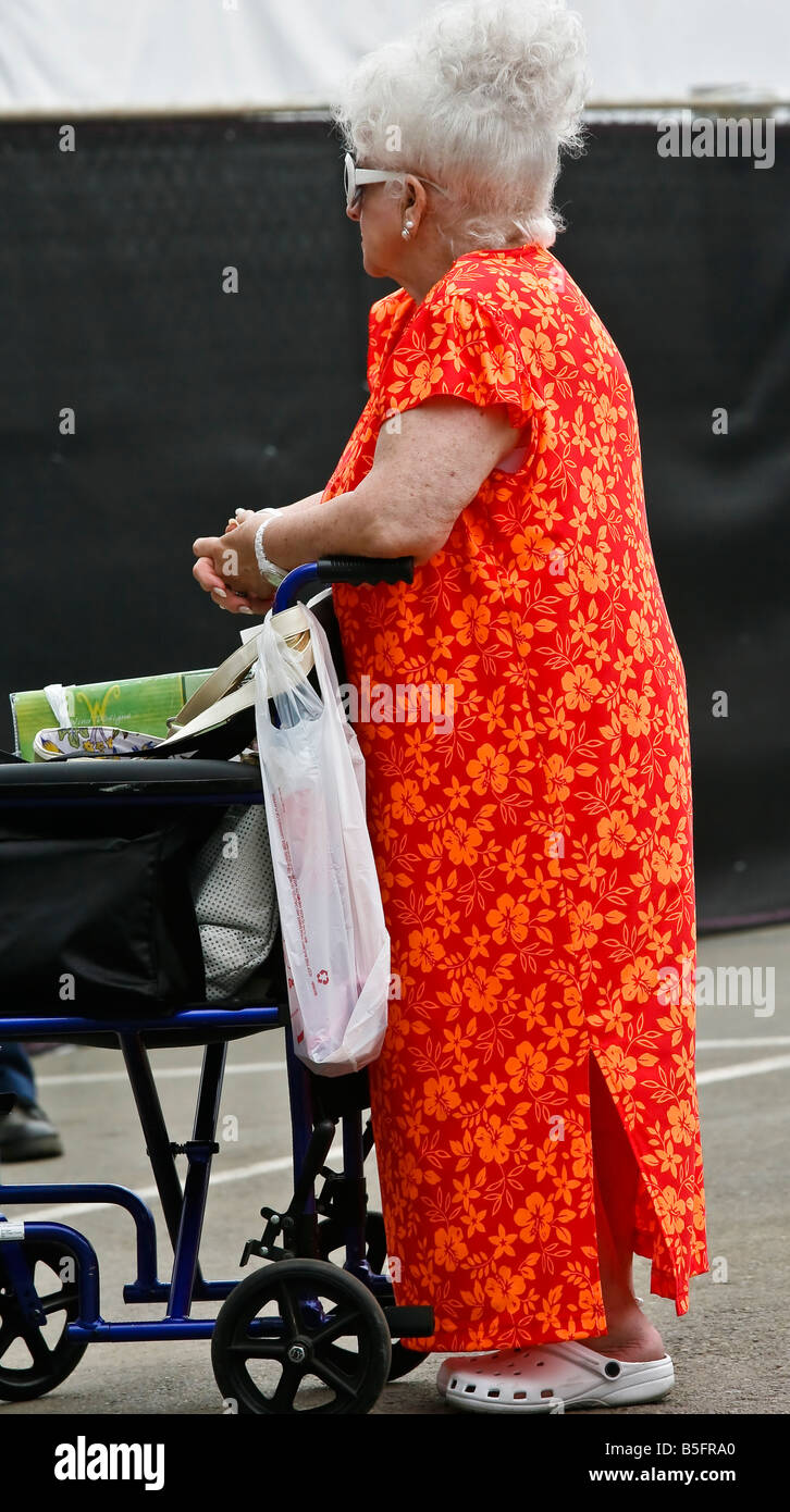 Senior woman with walker watching dance program at the San Diego County ...