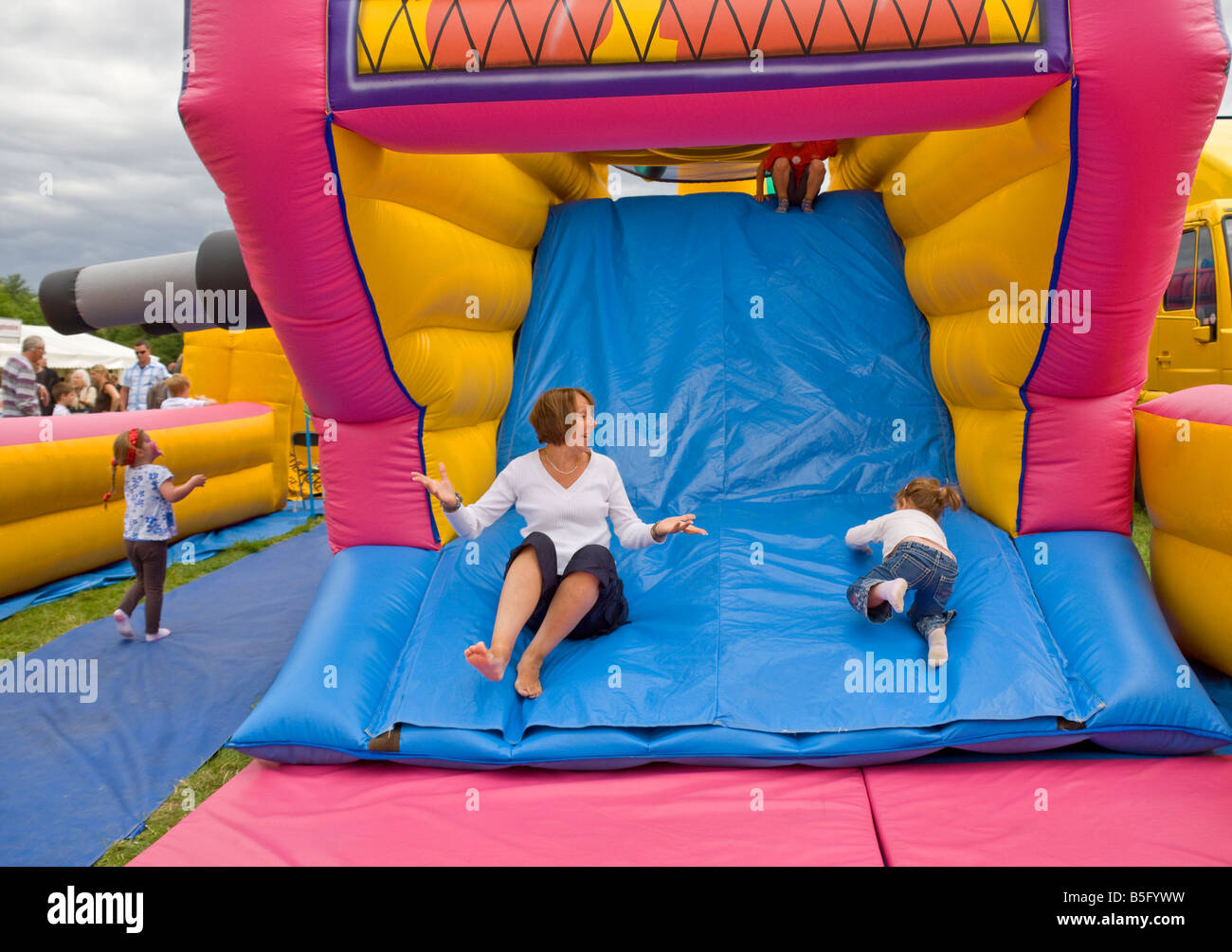 Family having fun on a slide Stock Photo - Alamy