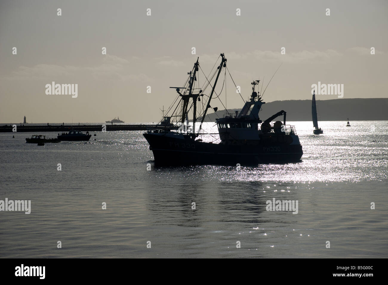 Fishing boat returning to harbour Stock Photo - Alamy Fishing boat returning to harbour Stock Photo - Alamy