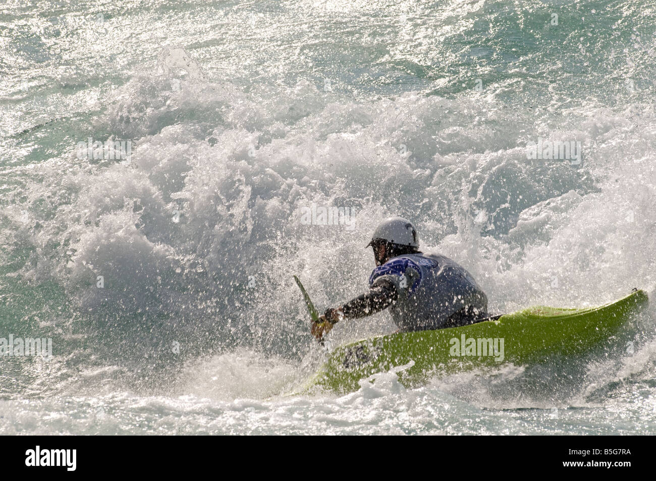 Competitor in whitewater kayaking competition Stock Photo - Alamy