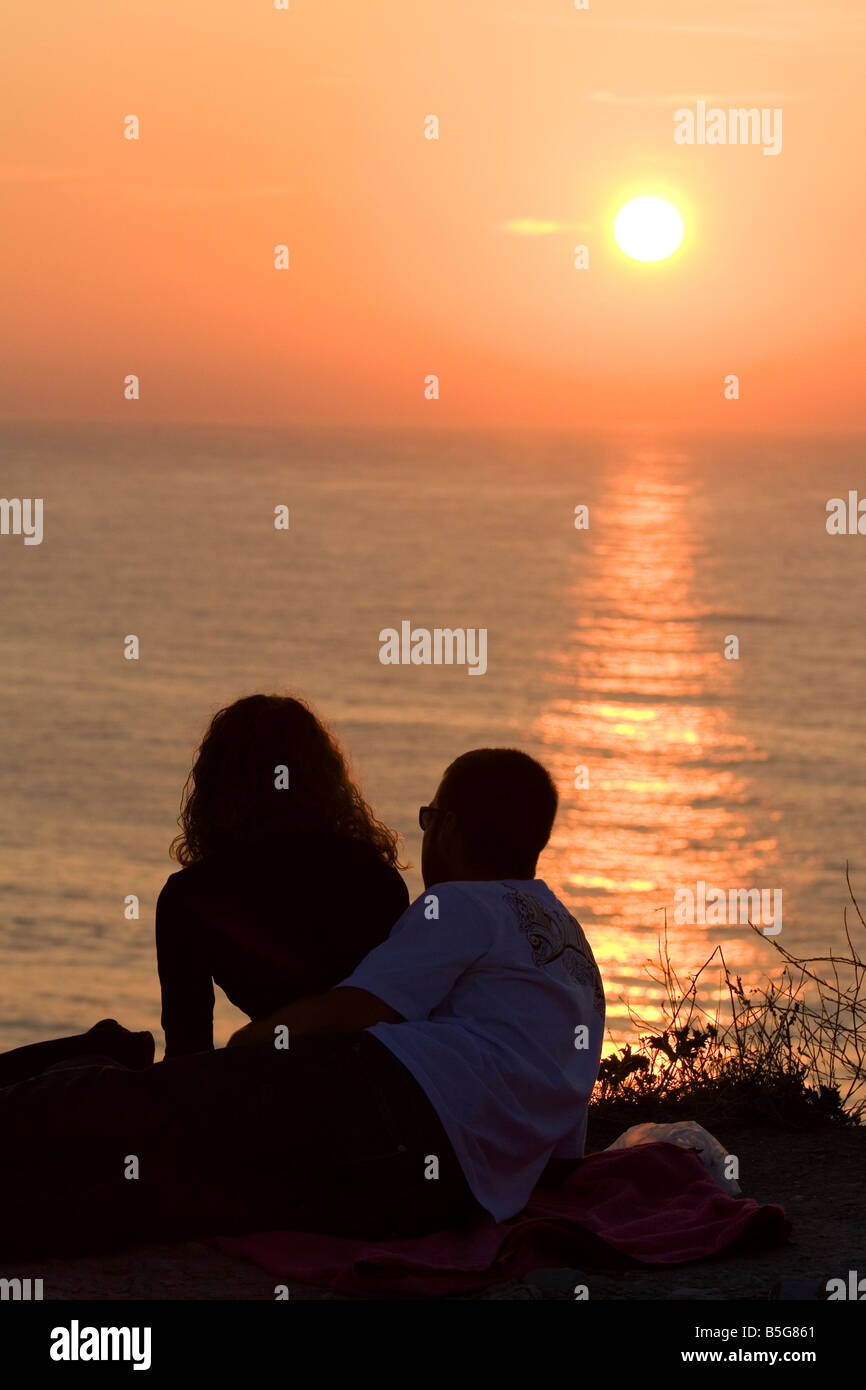 Couple watching sunset over ocean hi-res stock photography and images ...
