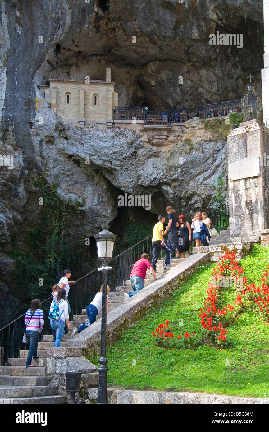 Visitors climb stairs to the Holy Cave at Covadonga Asturias ...