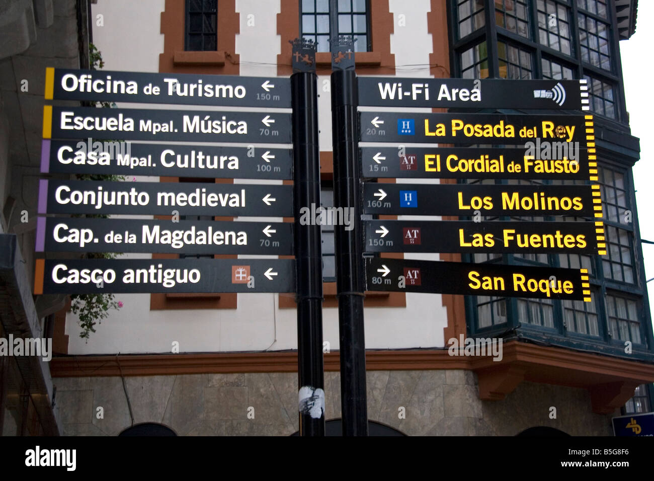 Spanish language direction sign in the town of Llanes Asturias Spain ...