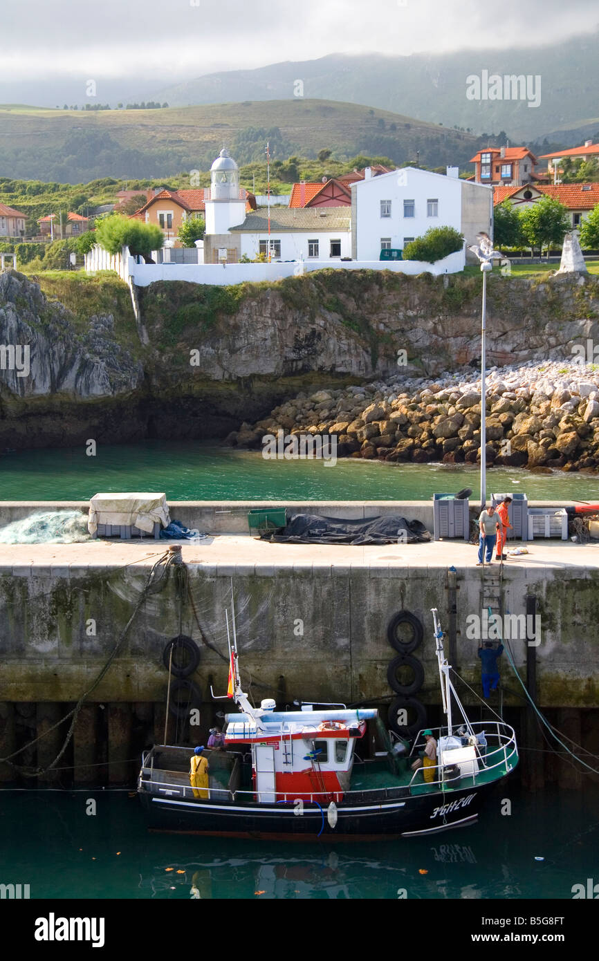 Fishing boat in the harbor at Llanes Asturias Spain Stock Photo - Alamy