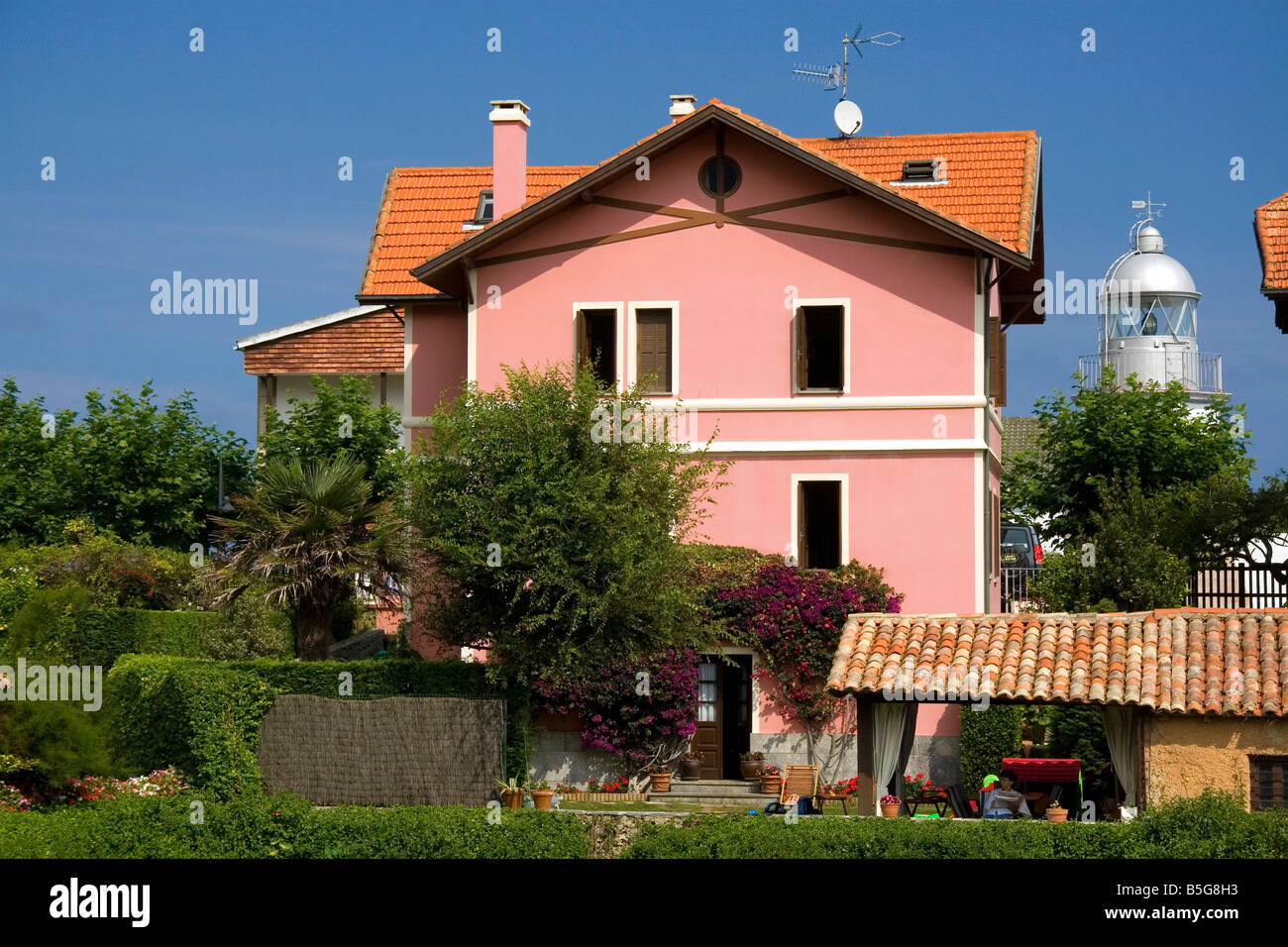 Residential home and lighthouse in the town of Llanes Asturias Spain ...