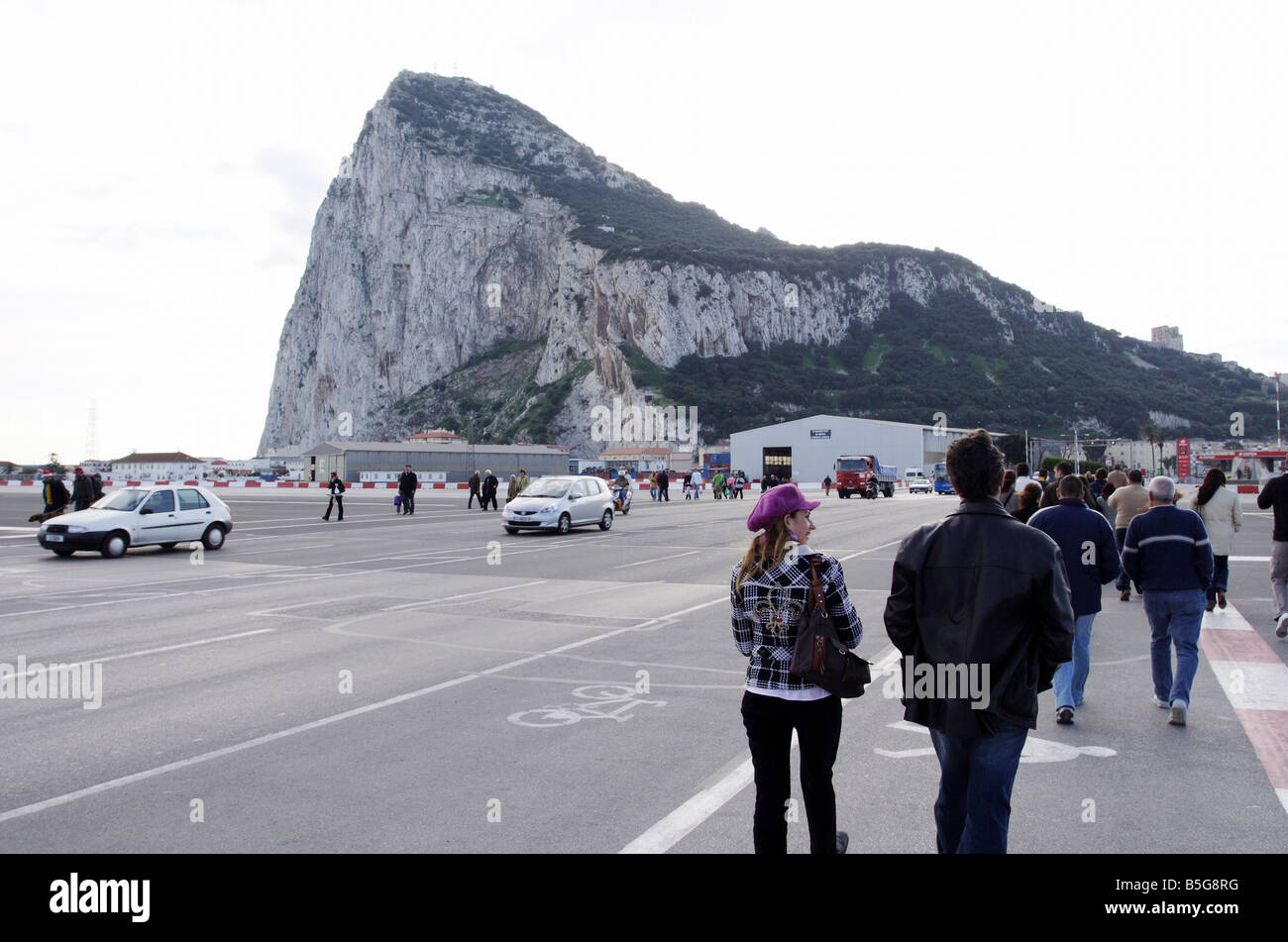 Pedestrians crossing the runway in Gibraltar Stock Photo - Alamy
