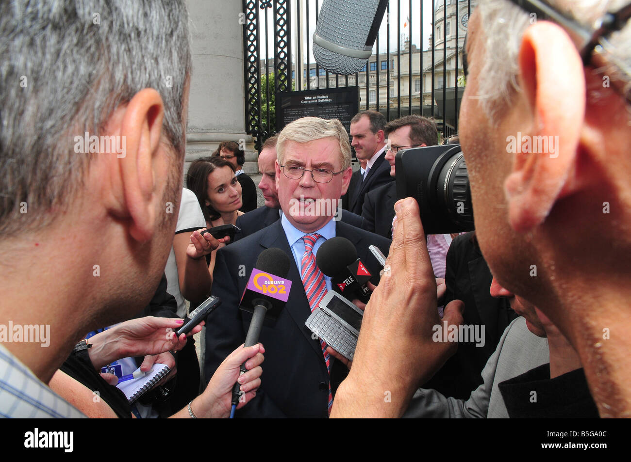 Eamon Gilmore leader of the Irish Labour party outside Government bldgs ...