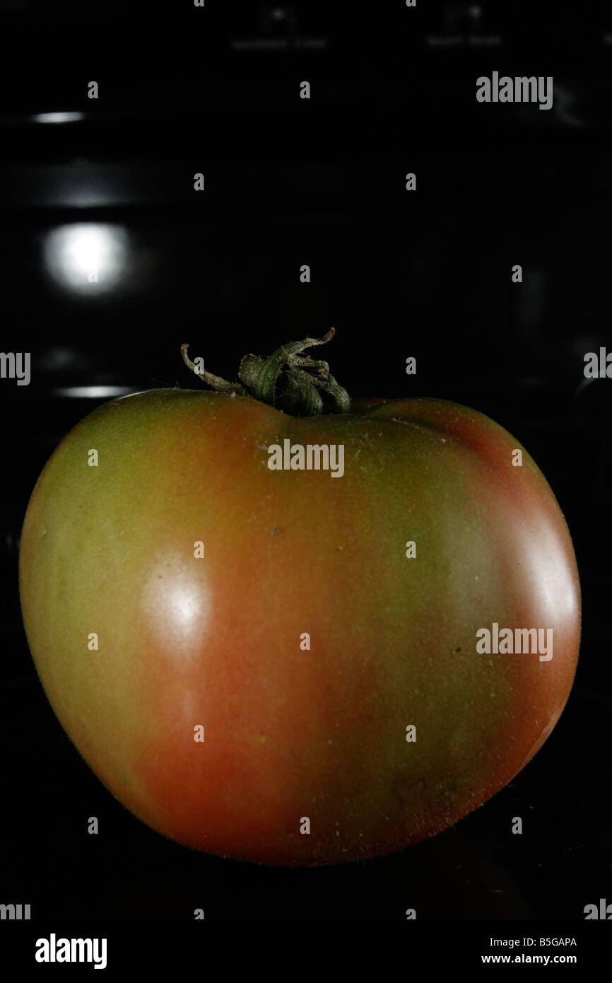 Striped green and red tomato Stock Photo - Alamy
