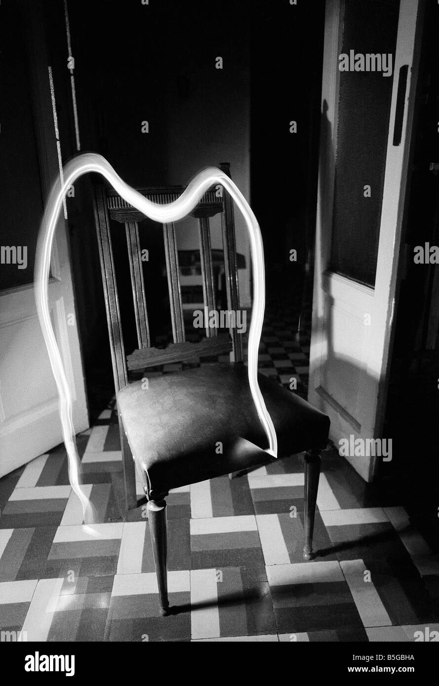 Chair and light effect. Black and white Stock Photo - Alamy