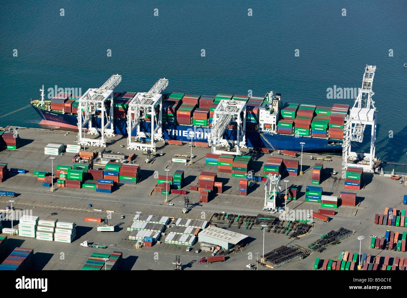 aerial view above cranes unloading Evergreen containers from ...