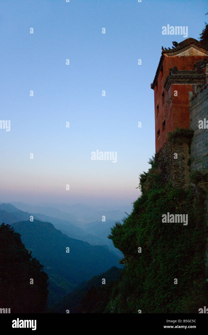 Taoist temple with mountain in the distance at sunrise Jinding Scenic ...