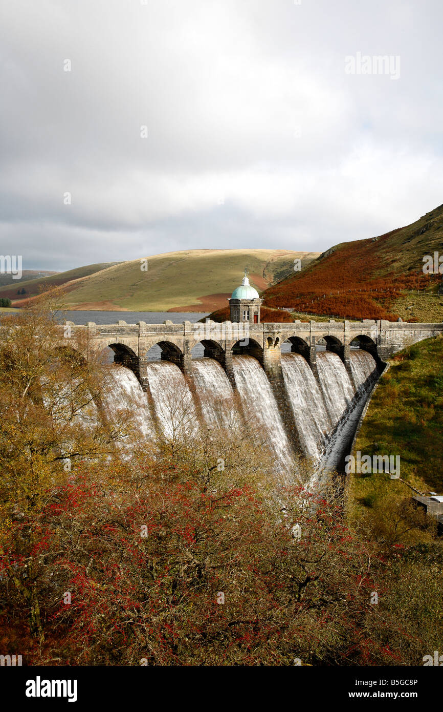 Craig Goch dam overflowing with water and the Elan Valley Stock Photo ...