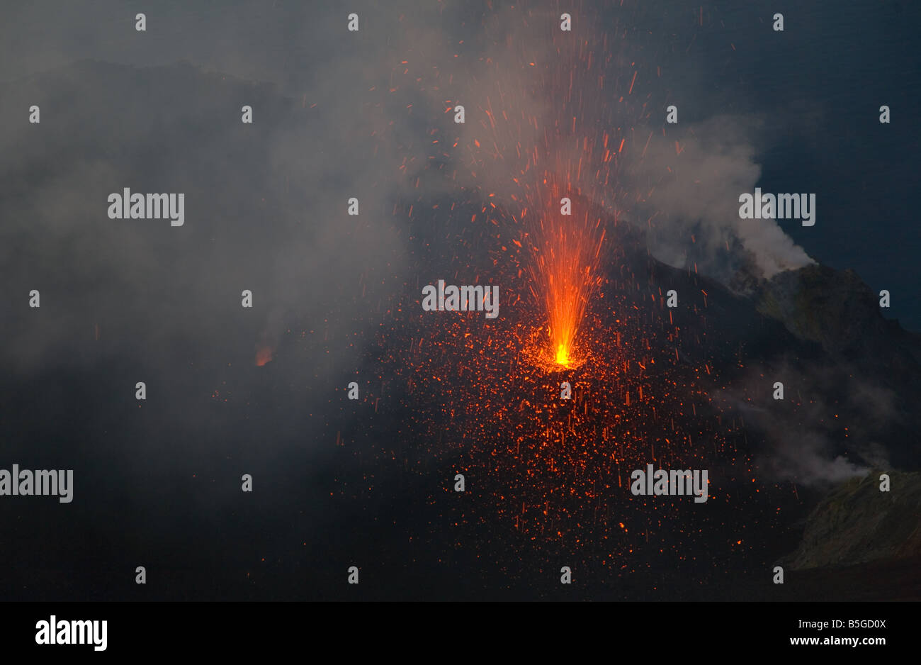 Night-time volcanic eruption from Stromboli's crater Stock Photo - Alamy